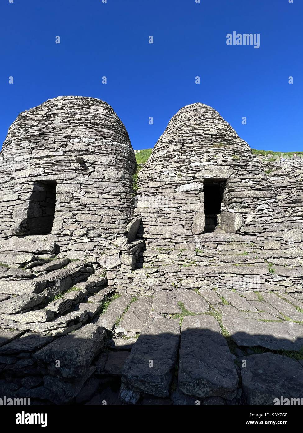 Beehive huts on Skellig Michael on a bright clear and hot sunny day ...