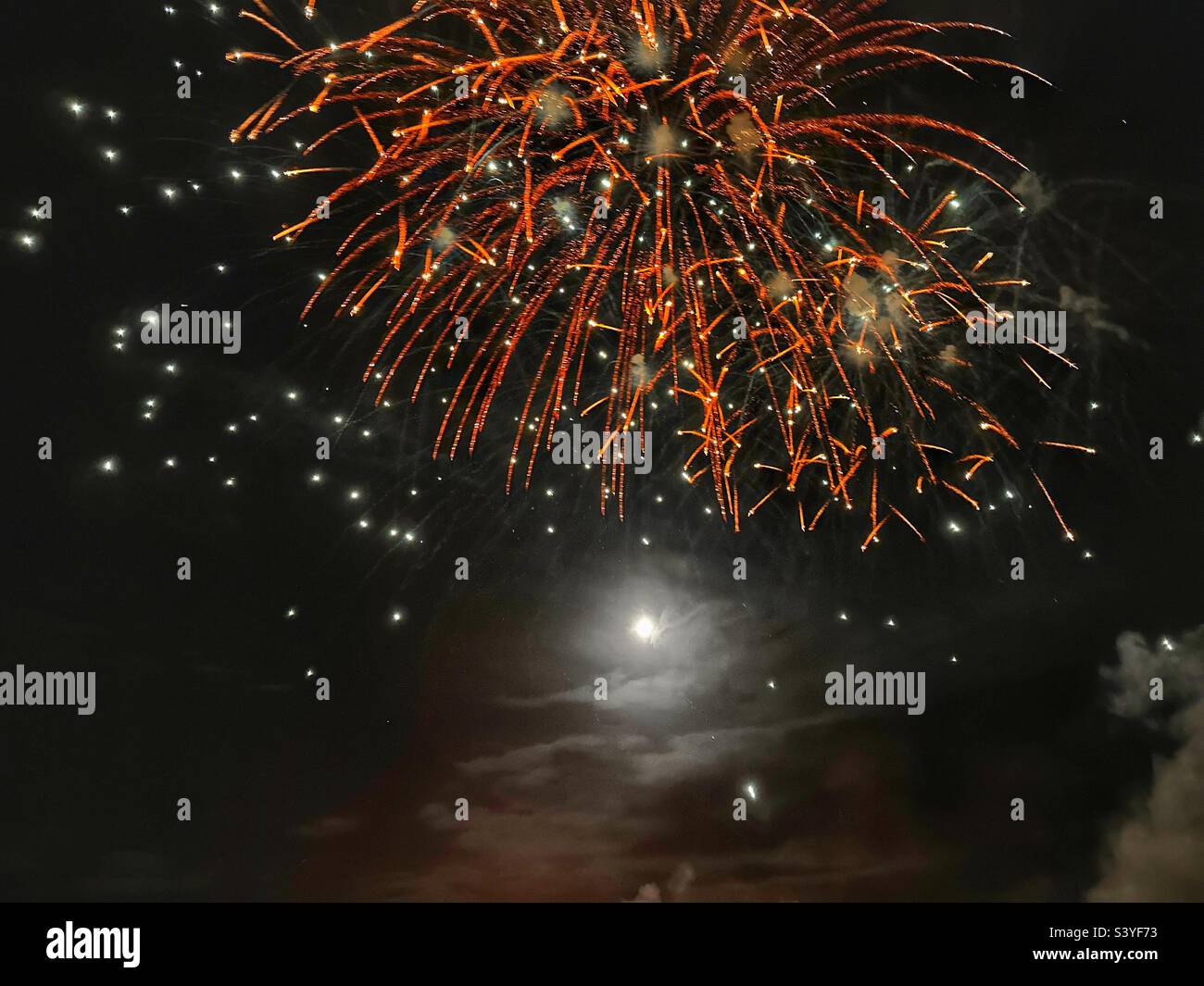 Fireworks and moon Stock Photo - Alamy