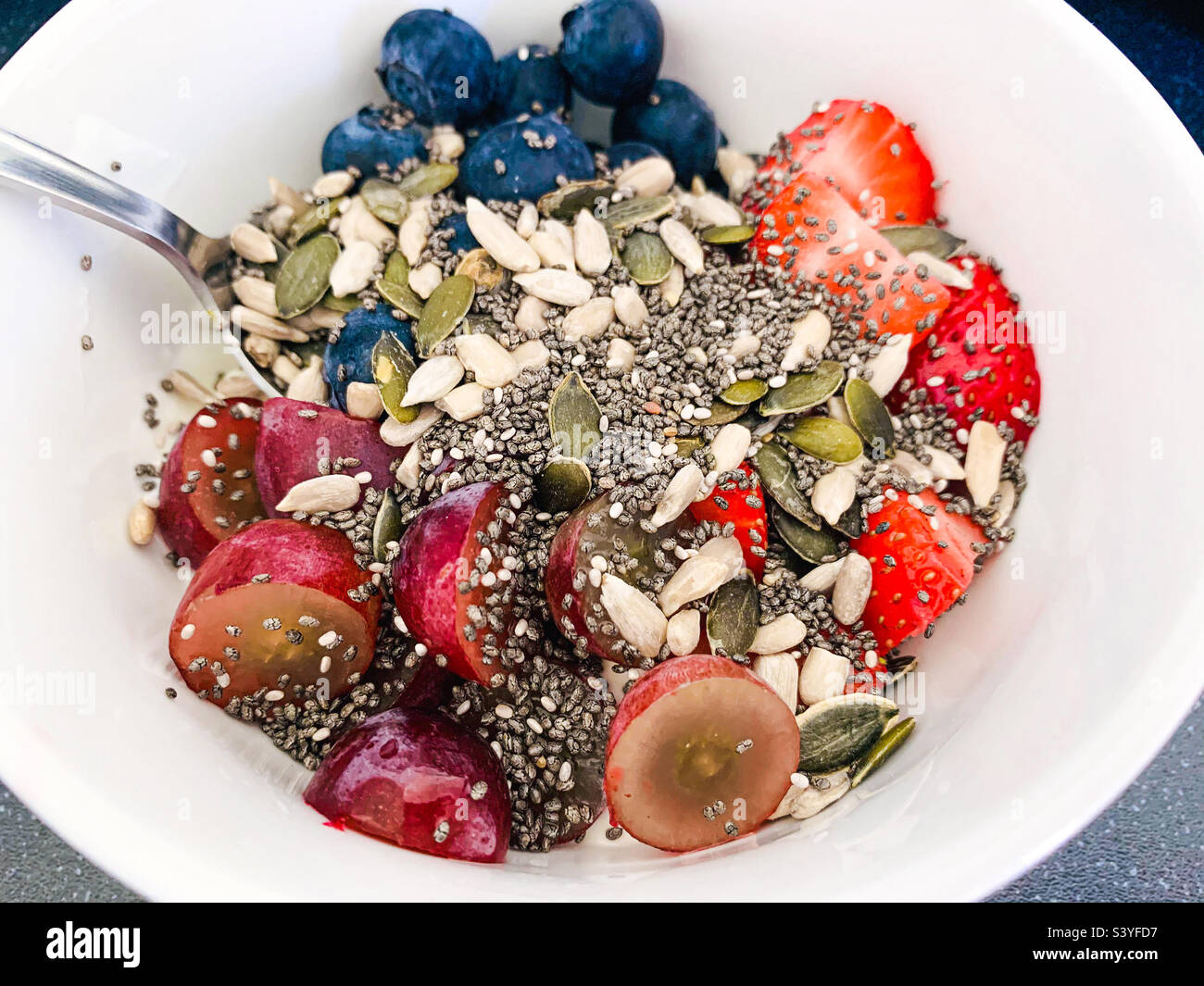 Fruit and seed breakfast bowl Stock Photo - Alamy