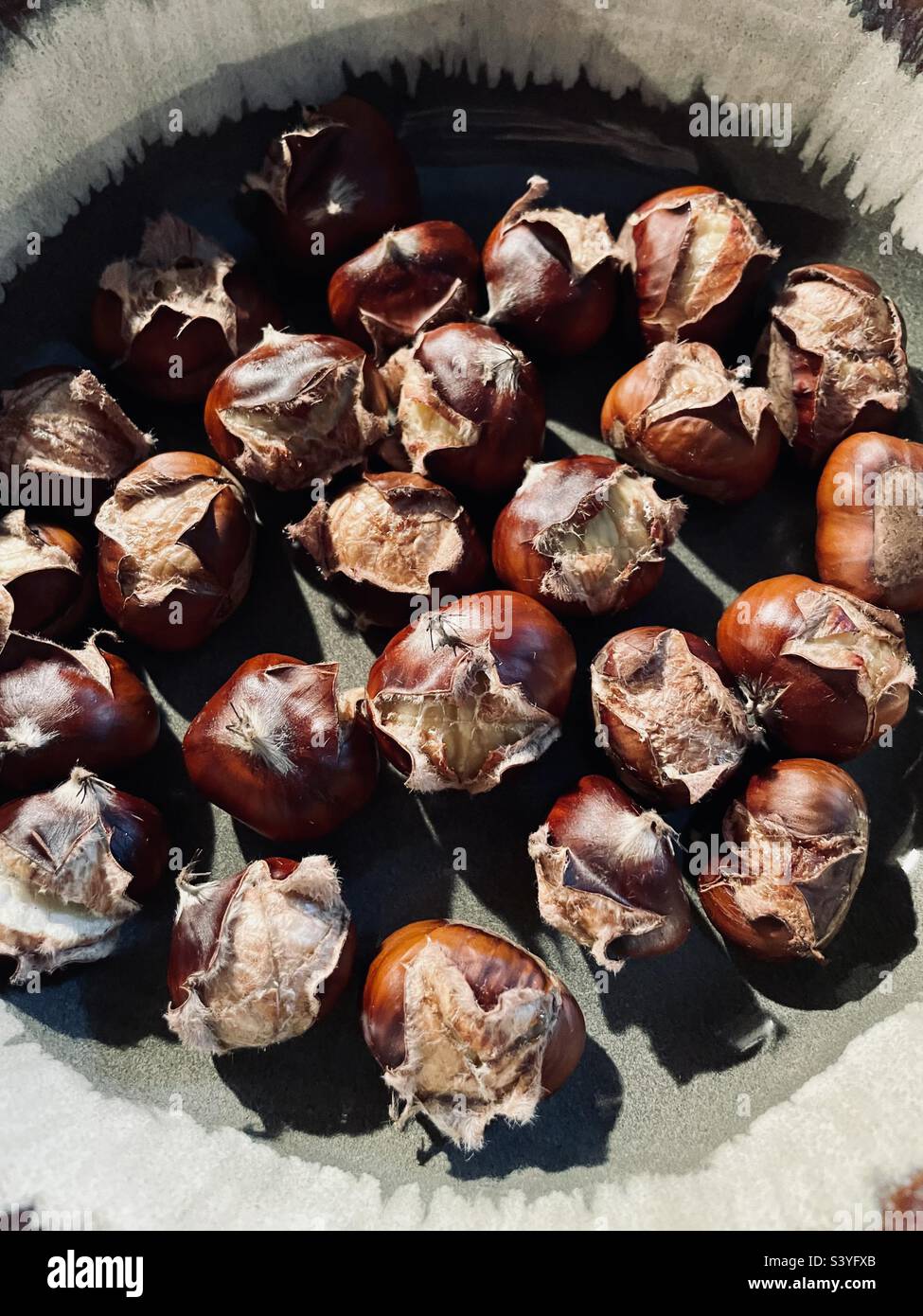 Roasted sweet chestnuts hi-res stock photography and images - Alamy