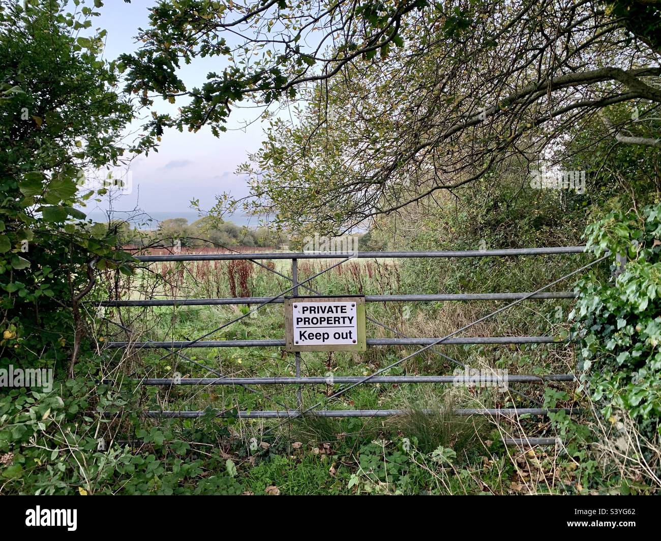 Private property Keep out sign on gate of field Stock Photo - Alamy