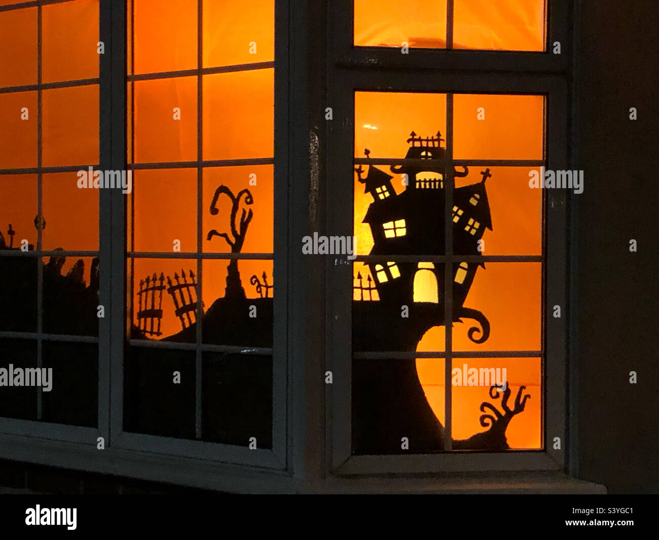 Glow house window silhouette hi-res stock photography and images - Alamy