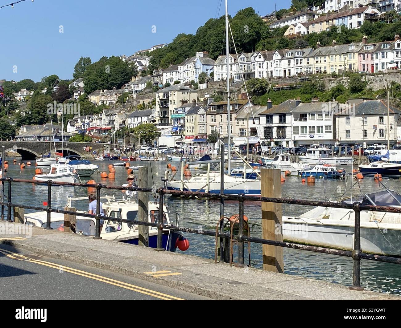 Crowded moorings on the River Looe in summer sunshine, Cornwall, UK ...