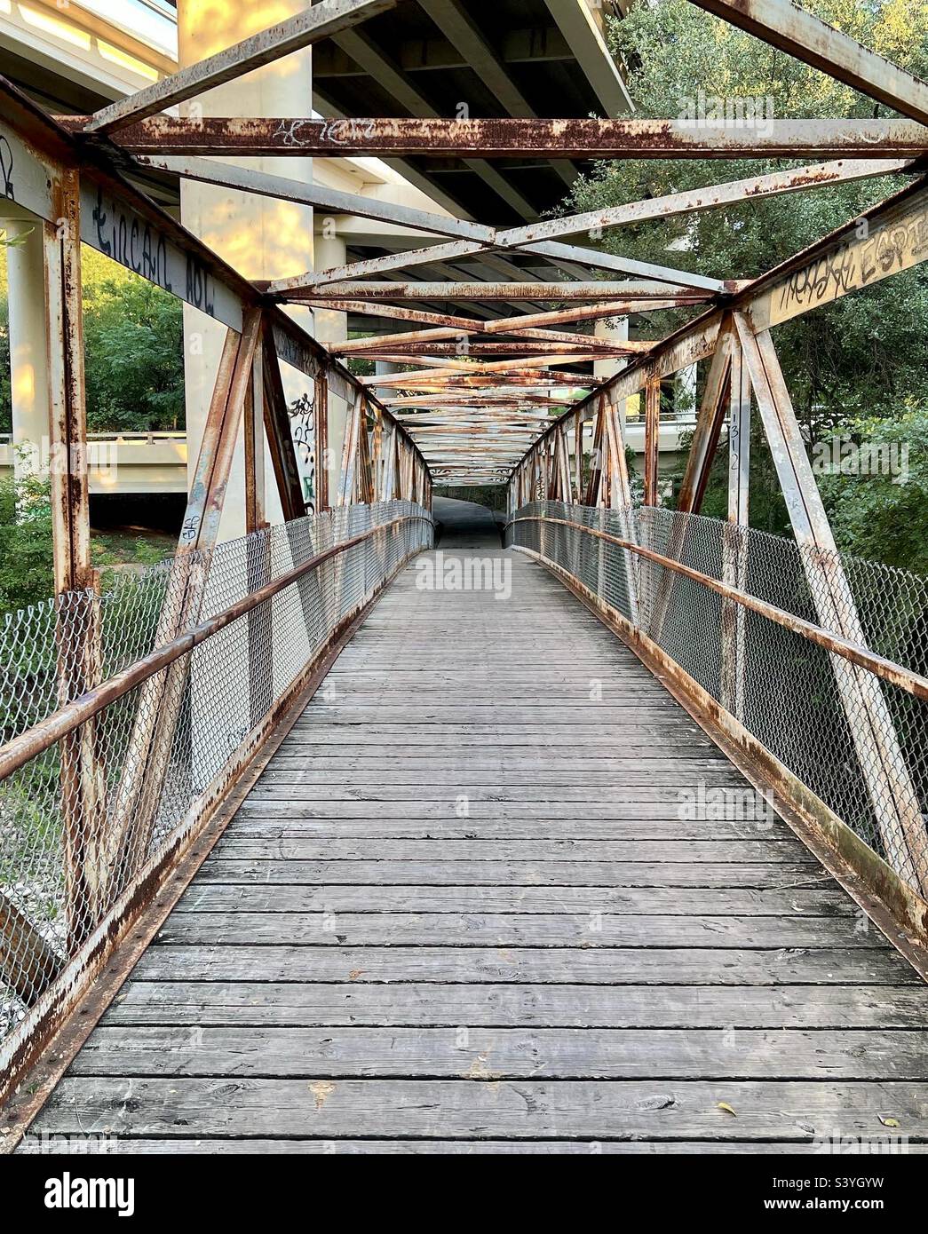 Iron pedestrian bridge on the trail on Lady Bird Lake in Austin Texas ...