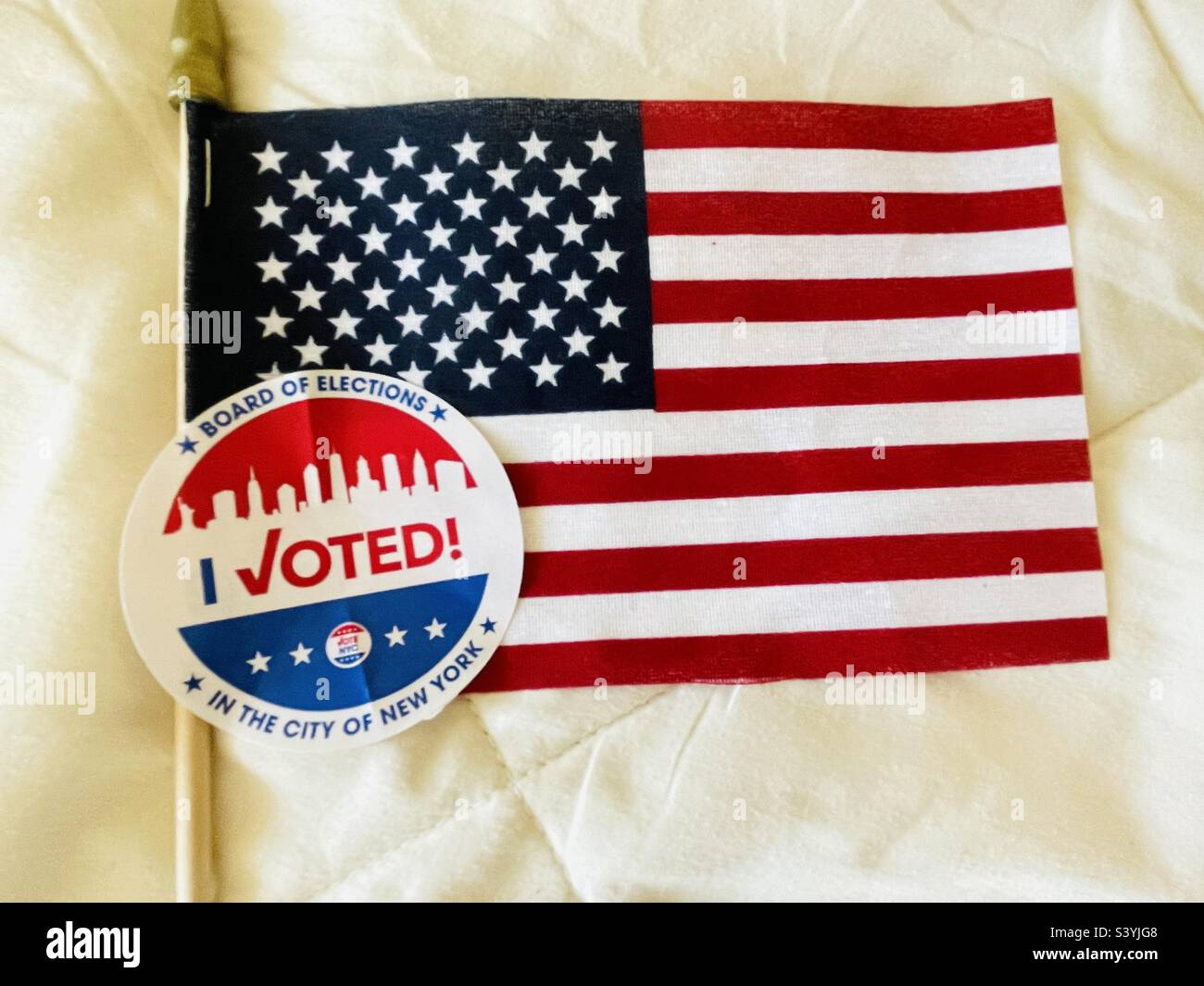 I voted sticker on an American flag Stock Photo - Alamy