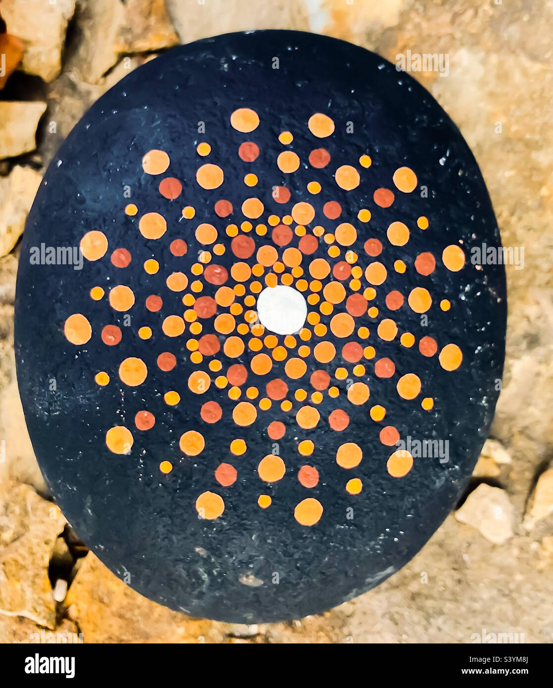 Painted pattern on a rock Stock Photo - Alamy