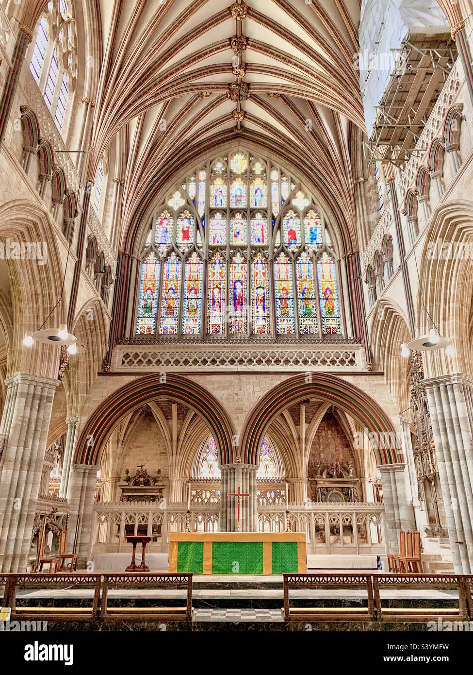 Interior of Exeter cathedral featuring the altar with carved stone ...