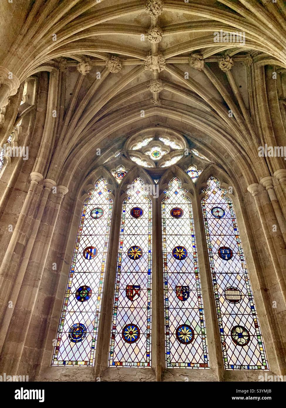 Large and beautiful carved stone stained glass window with colourful ...