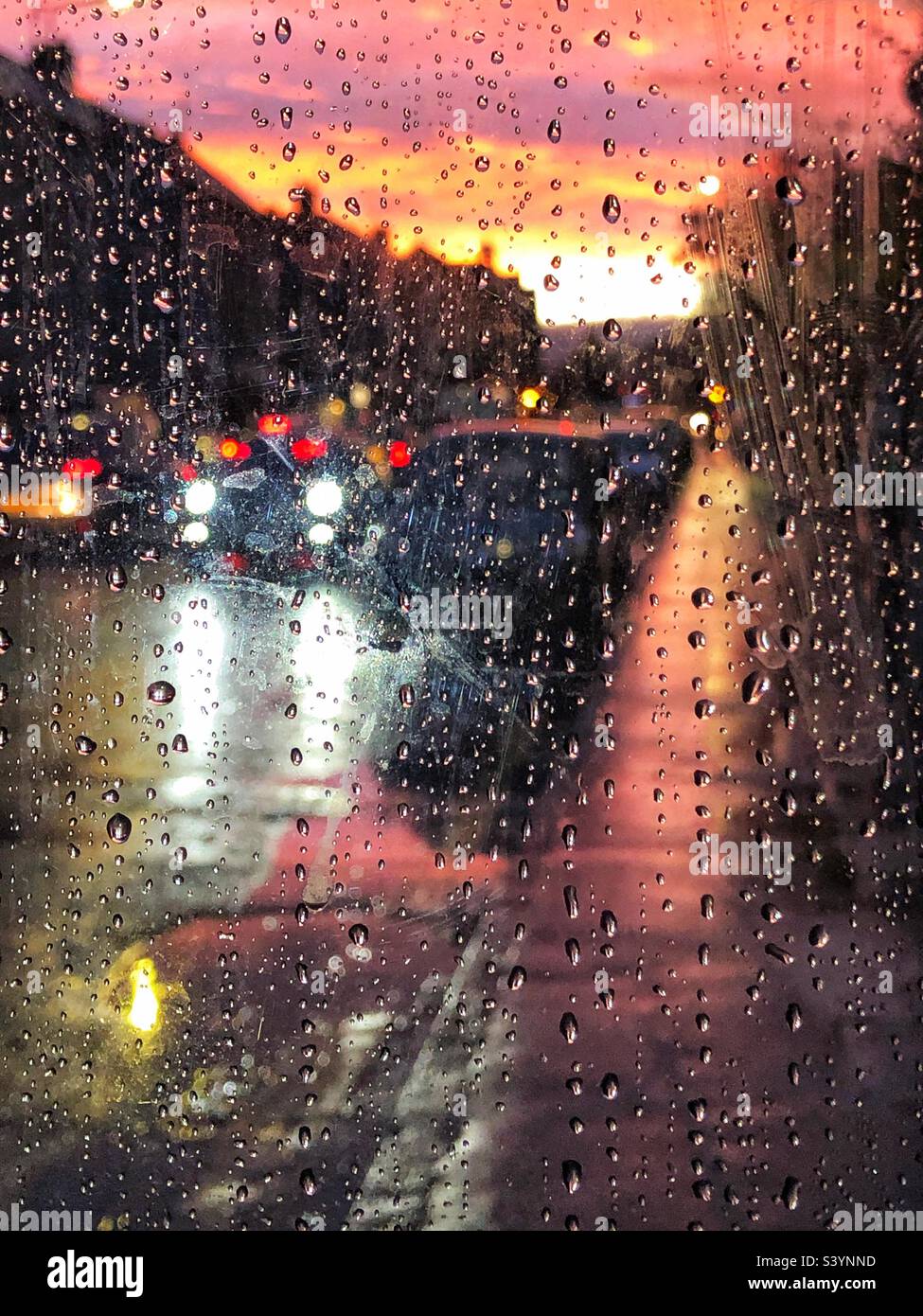 Sunset in a wet city centre Stock Photo - Alamy
