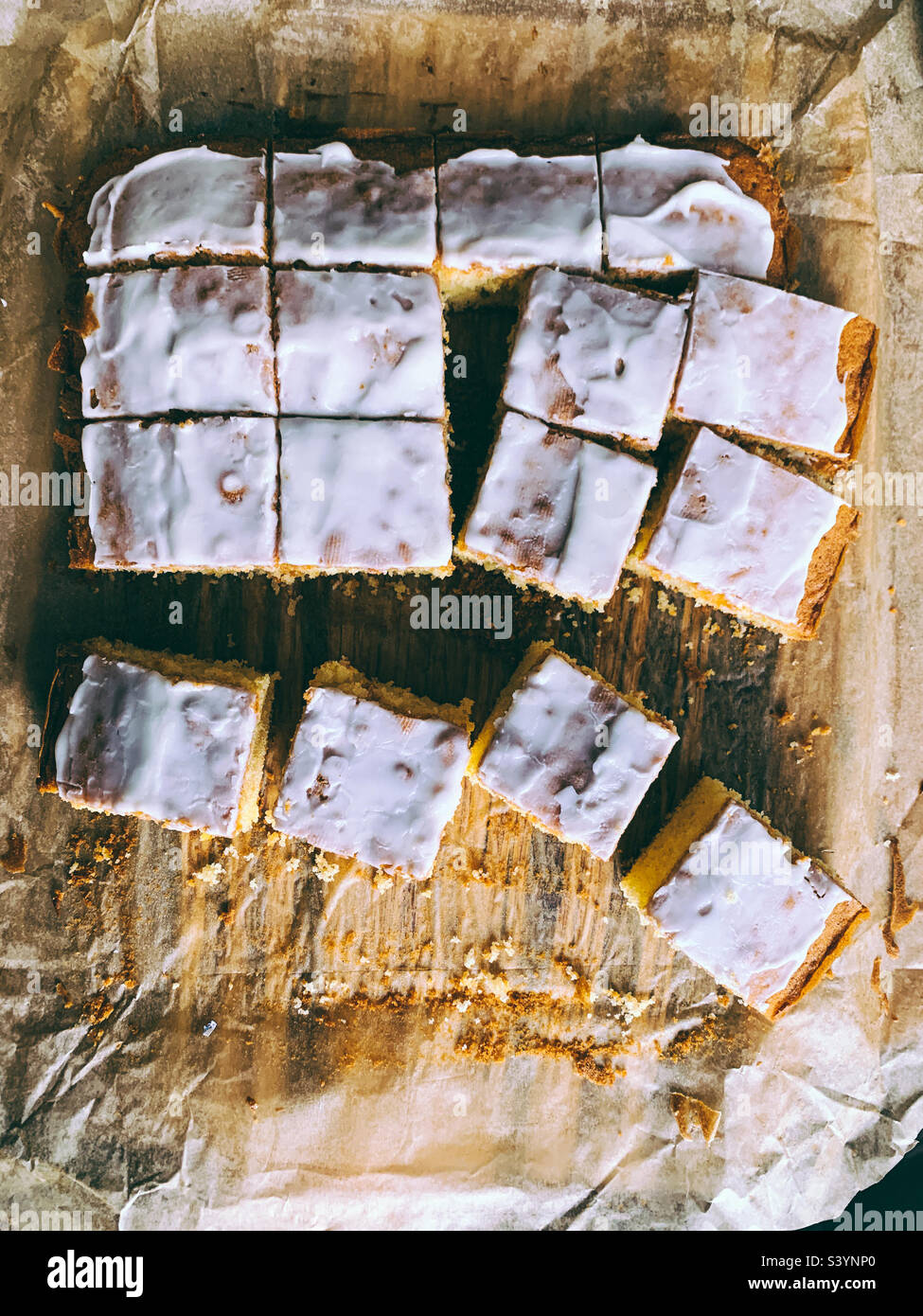 Homemade sponge tray bake with icing topping Stock Photo - Alamy