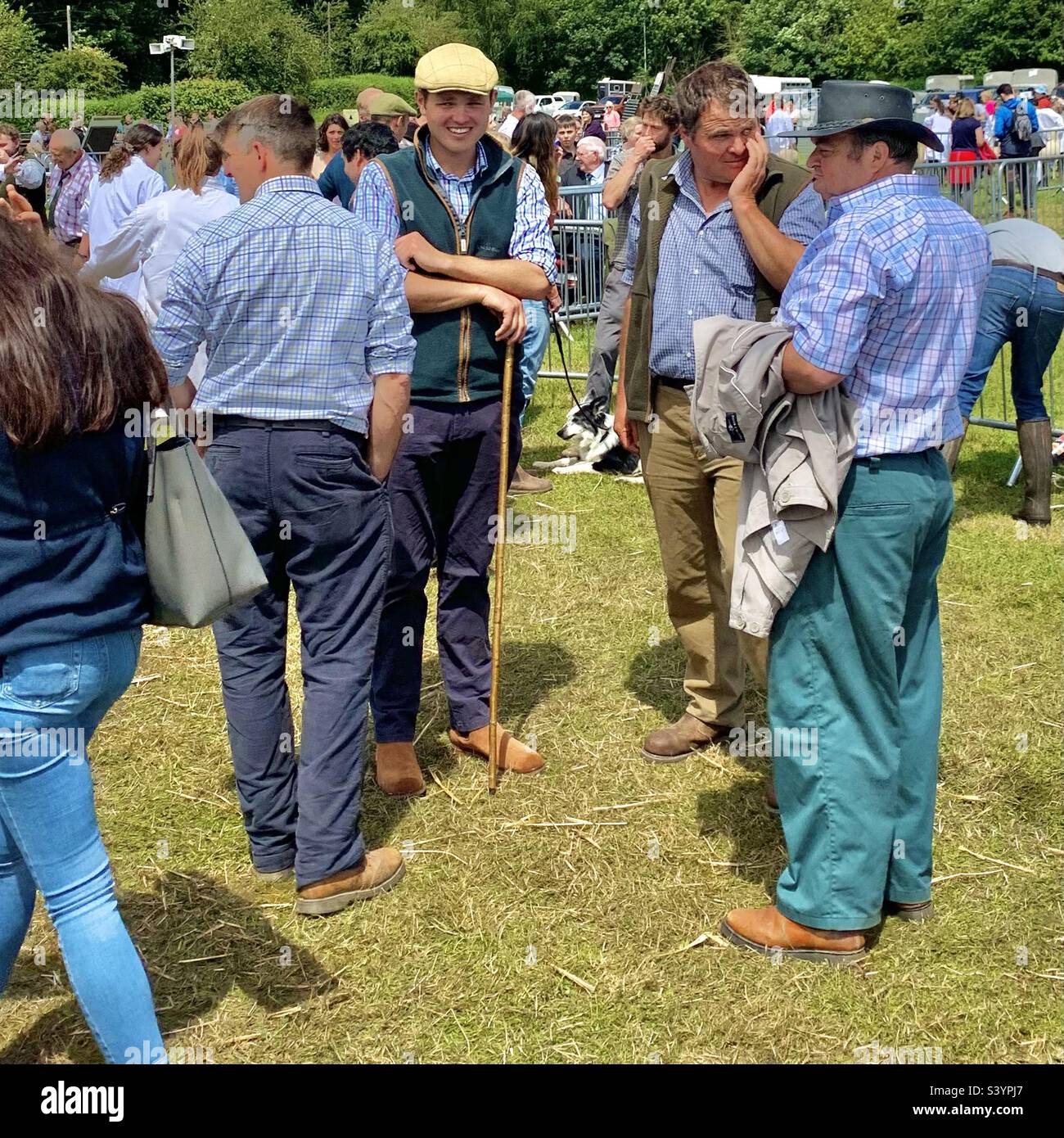 Group of farming men crowd together at the Devon county show in the ...