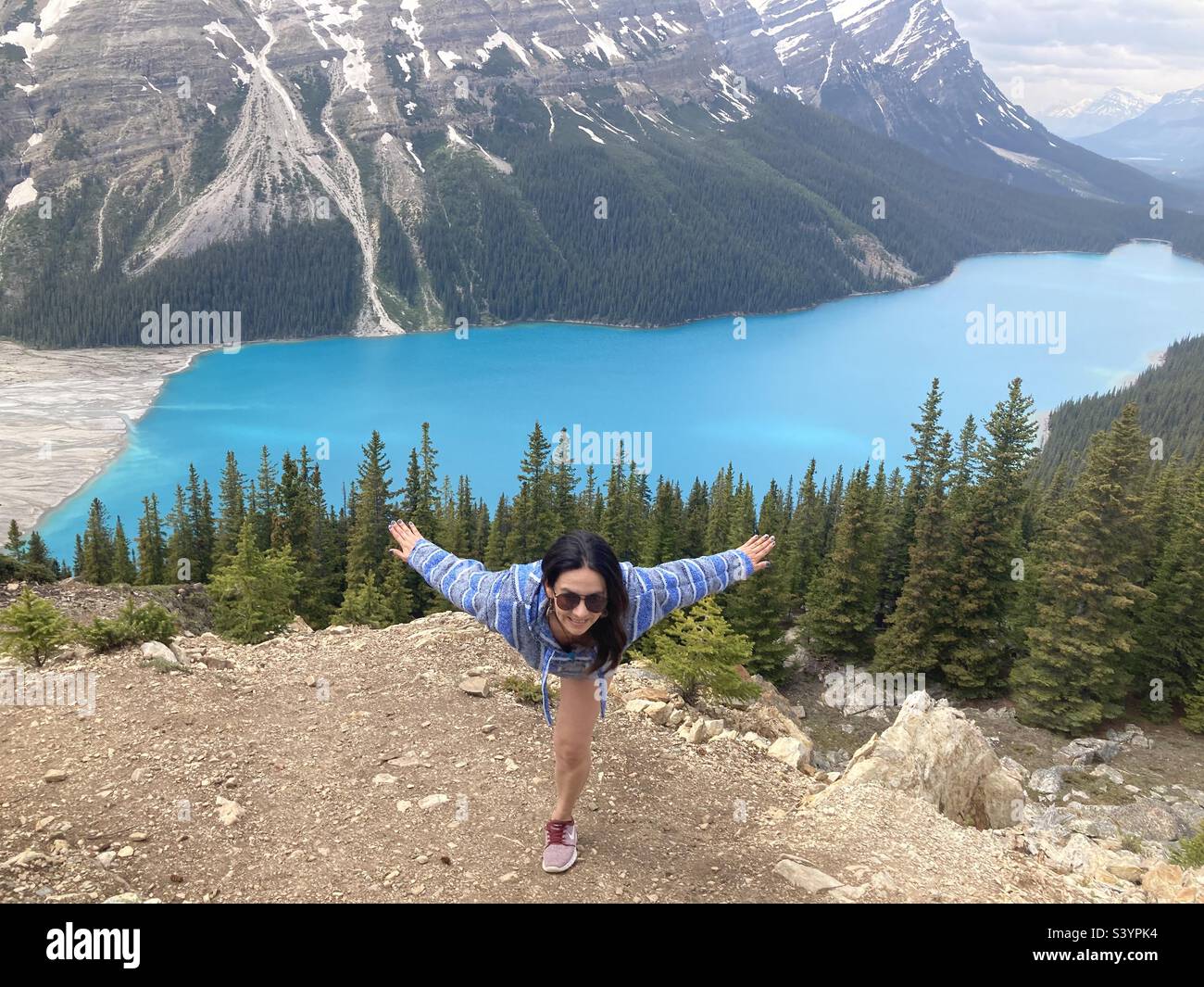 oh Canada moment. perfect blue lake and a bird girl trying to fly Stock ...