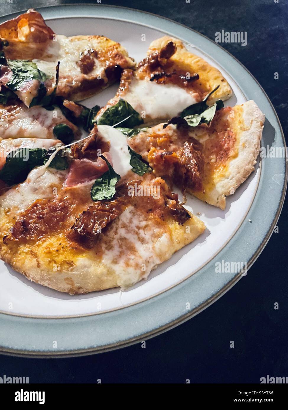 Perfect Saturday night grub. Homemade pizza Stock Photo - Alamy