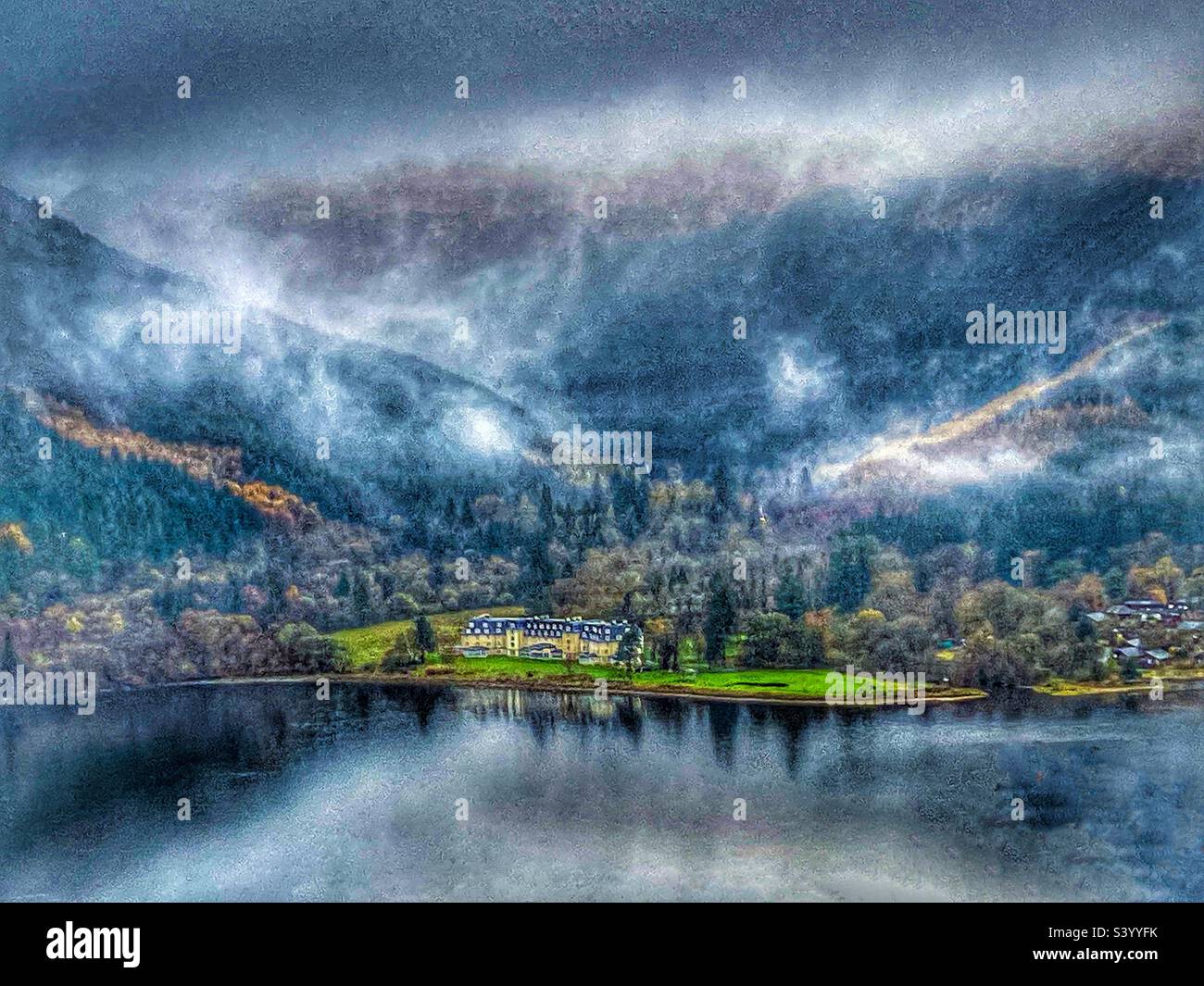 A dramatic misty view of the Ardgartan Hotel, sited at the foot of Glen ...