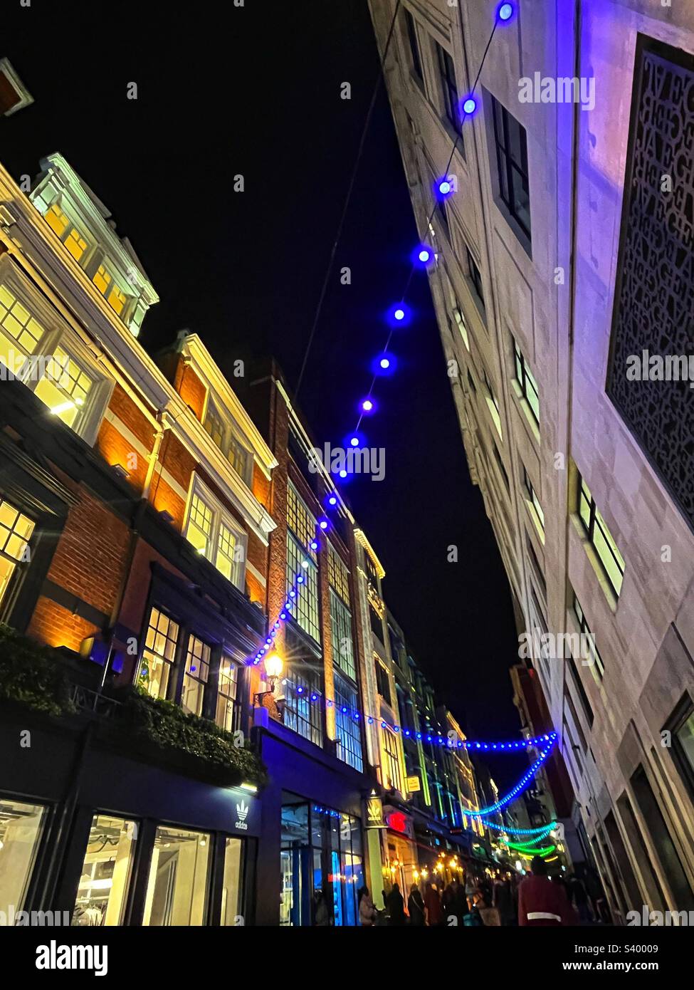String lights in a Soho Street rainbow colours for Christmas season in ...