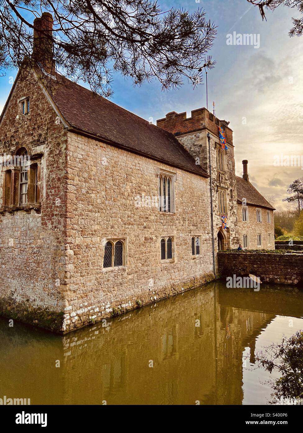 Side view of Ightam mote with main bridge entrance into the courtyard ...
