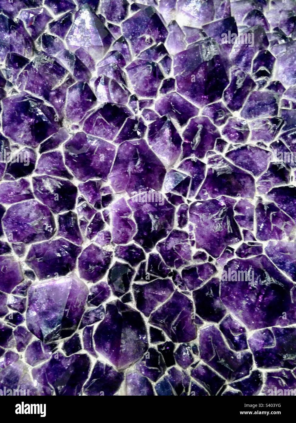 Deep purple, amethyst gemstone. Textured rock background Stock Photo ...