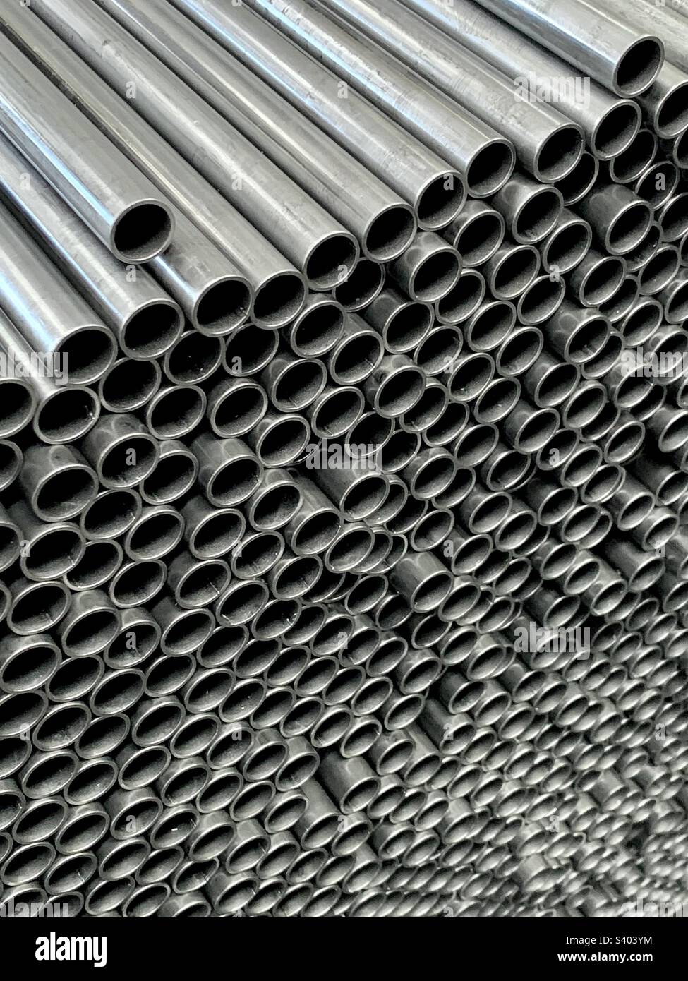 Metal tubes background Stock Photo - Alamy