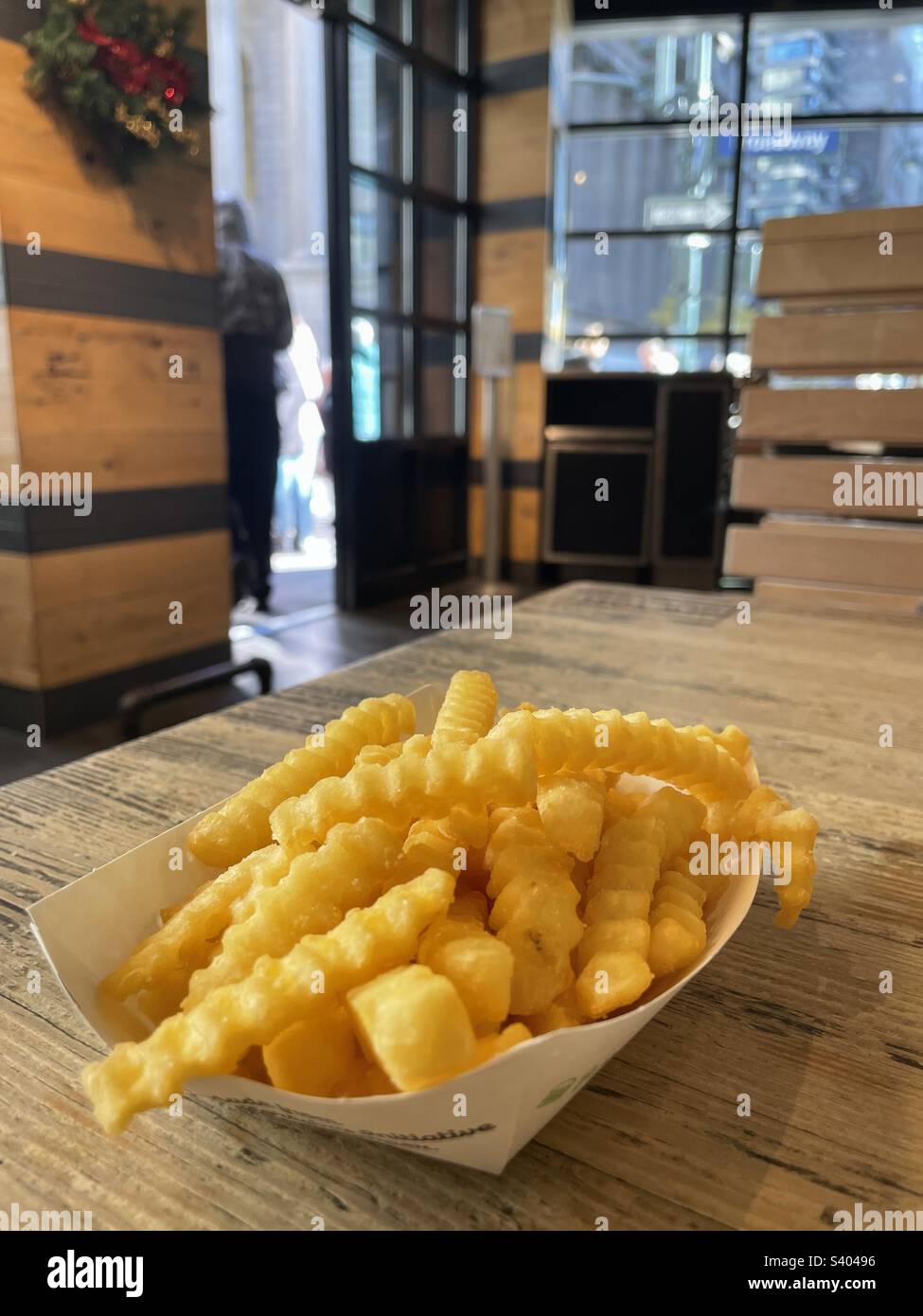 A basket of french fries add a shake shack restaurant Stock Photo - Alamy