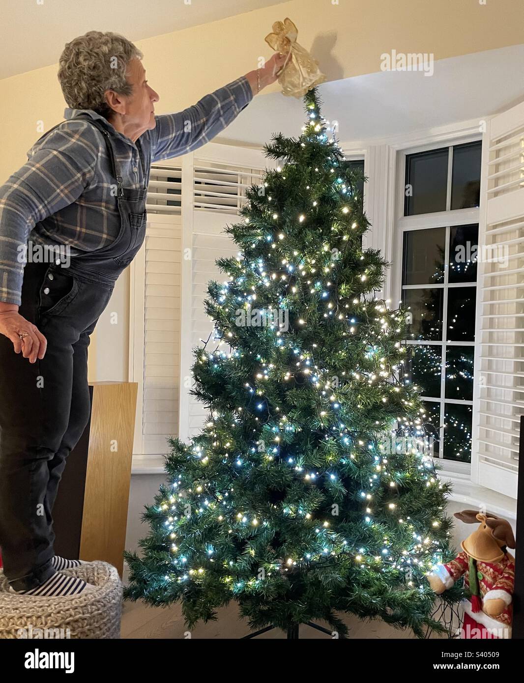 Decorating the Christmas Tree at Home Stock Photo - Alamy