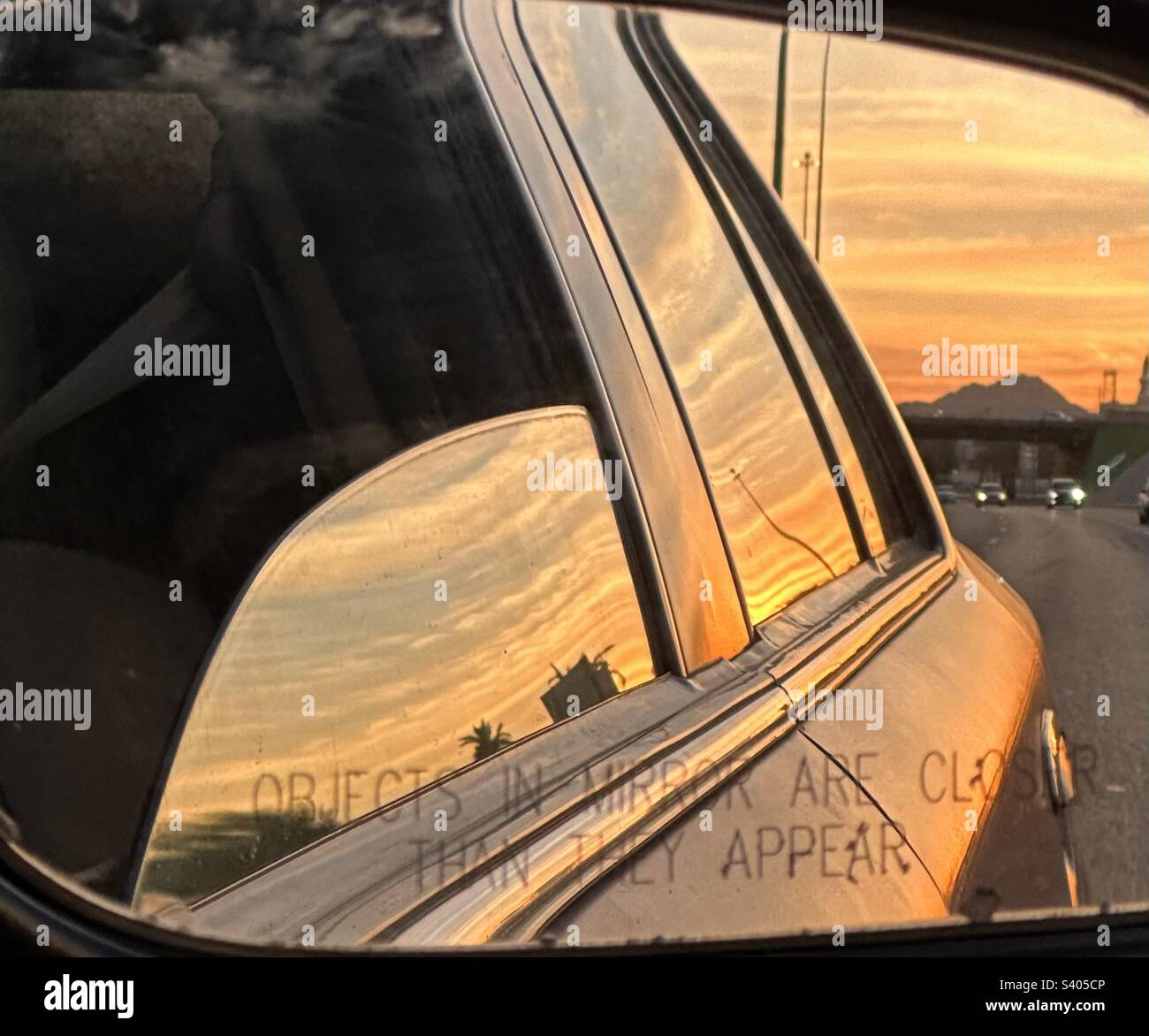 Beautiful sunset on car mirror Stock Photo - Alamy