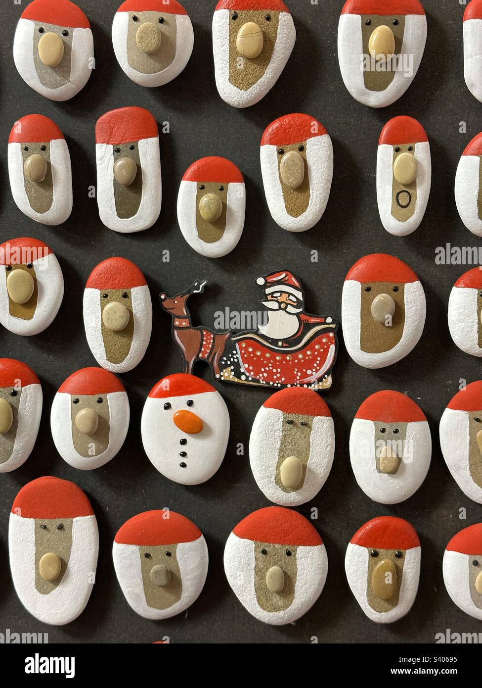 Many Santa Claus souvenirs in a Christmas market shop Stock Photo - Alamy