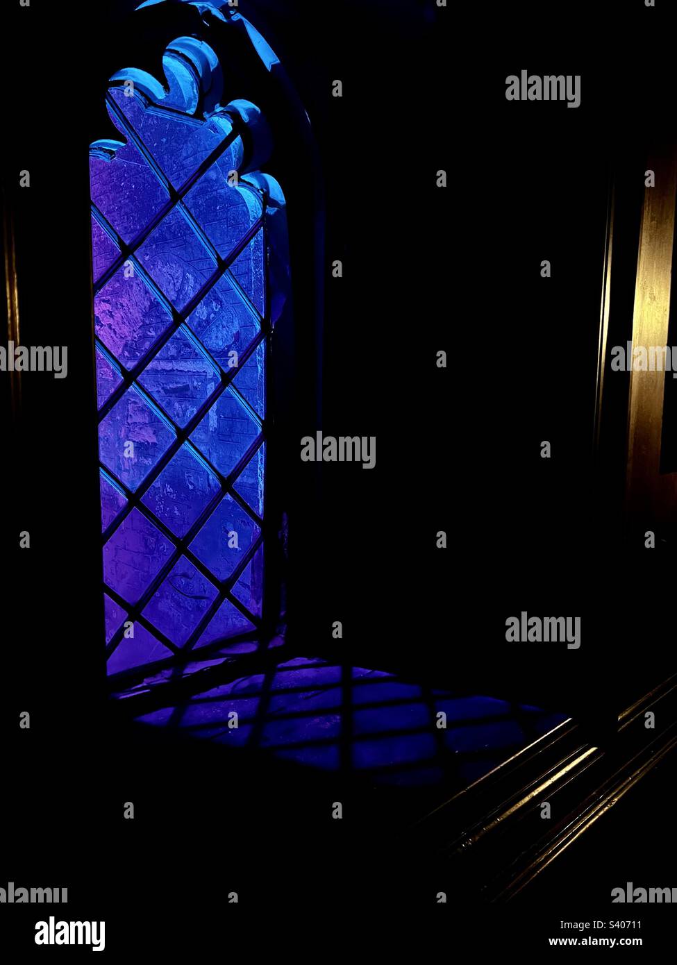 Purple light shining through an antique lead lined window Stock Photo ...