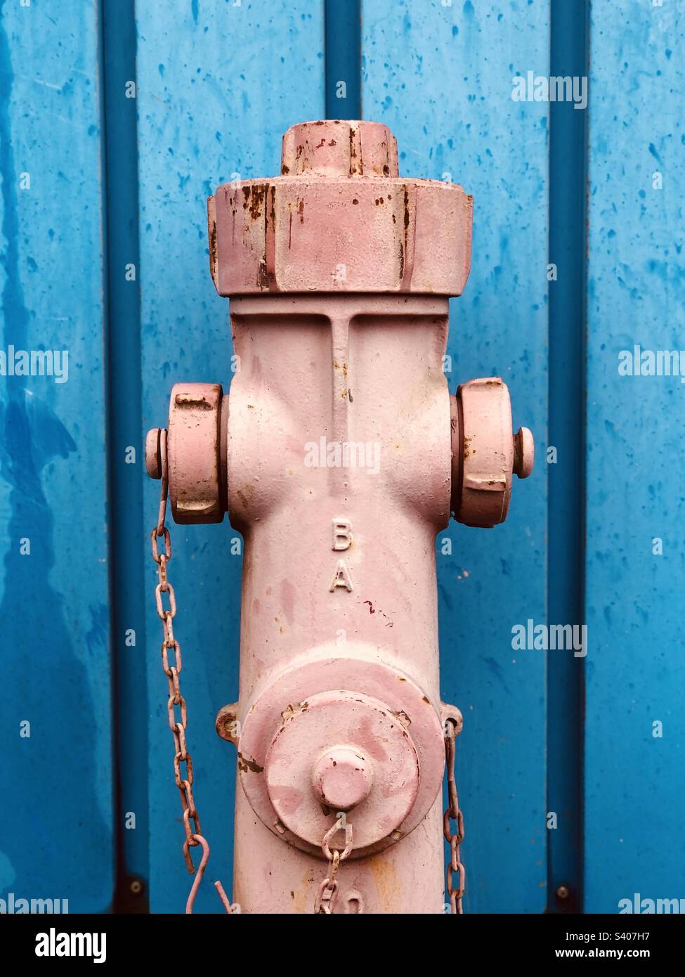 fire hydrant attack cyan pink contrast water Stock Photo - Alamy