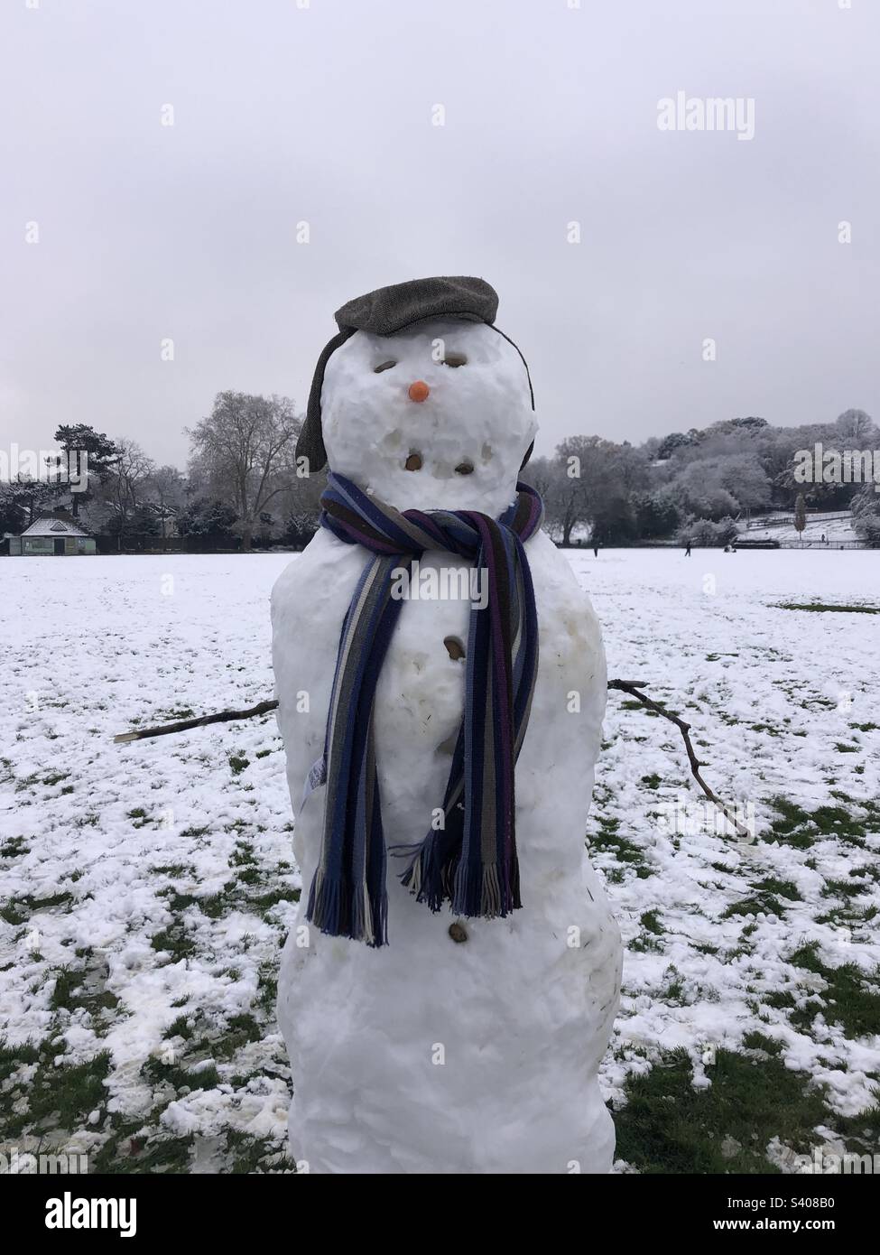 Snowman in a park in London Stock Photo - Alamy
