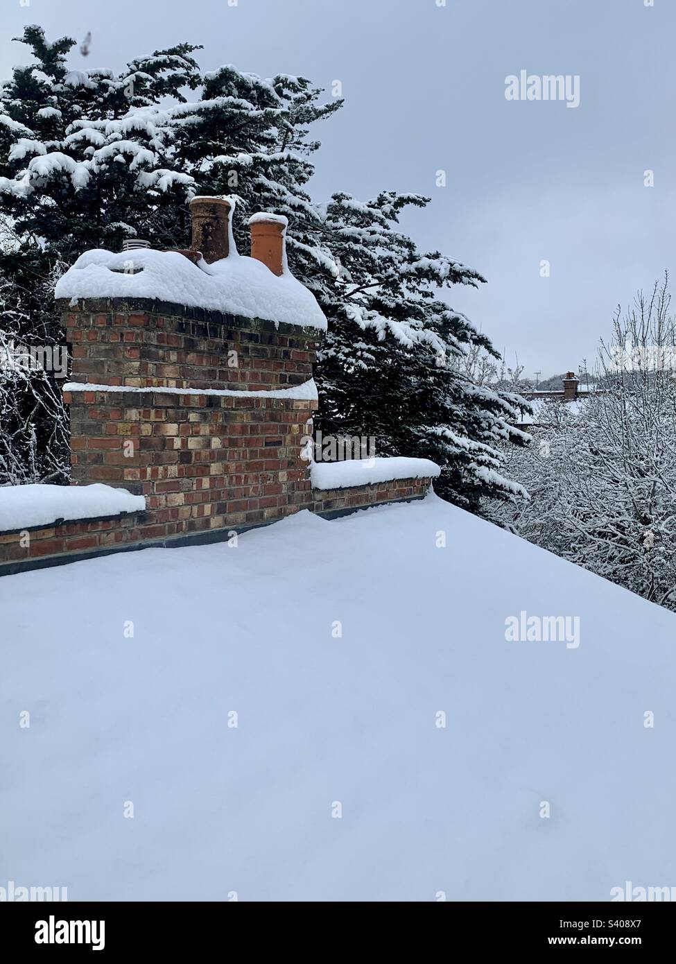 Snow covered rooftop and chimney stack Stock Photo - Alamy
