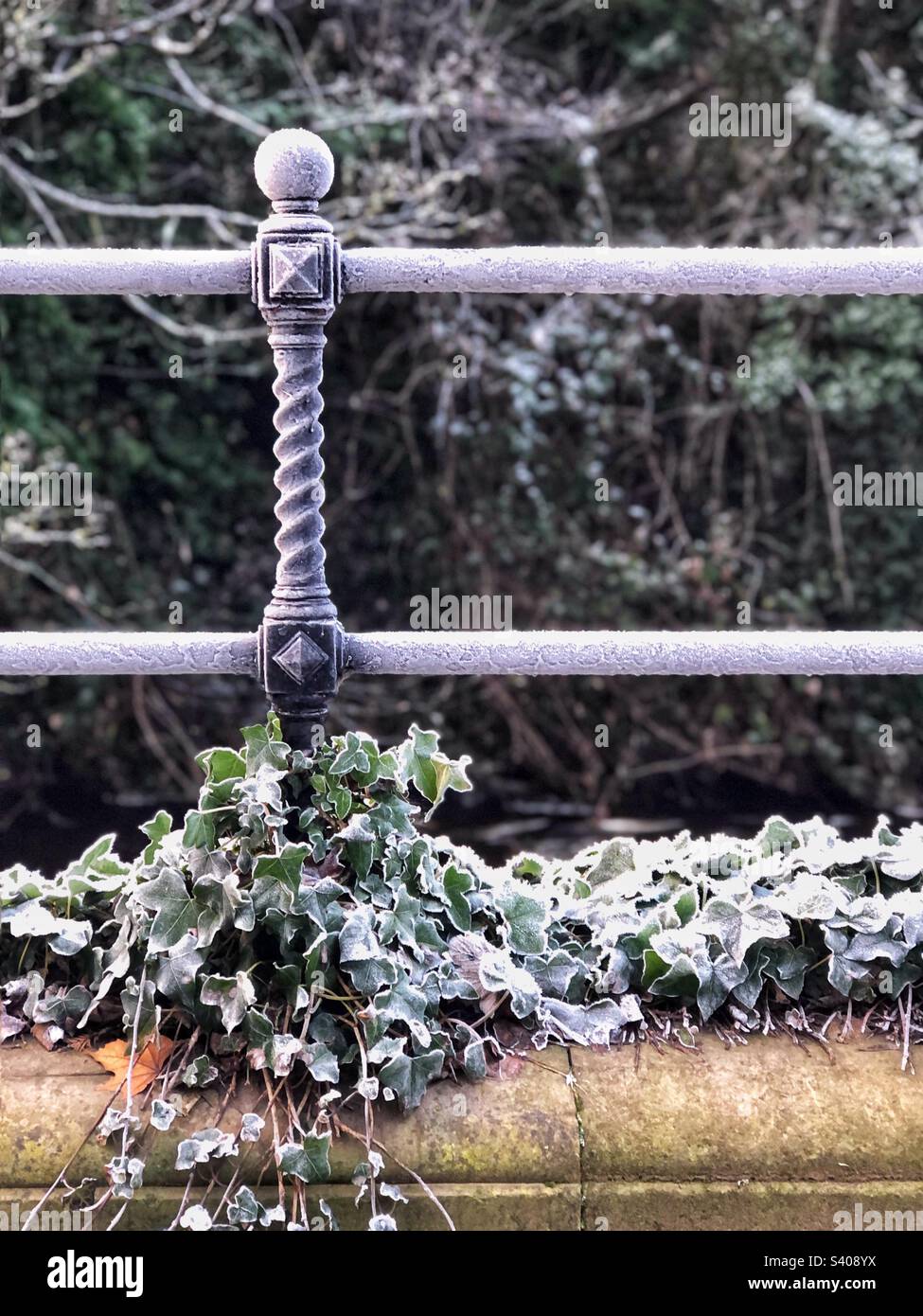 Frost encrusted ornamental fence post Stock Photo - Alamy