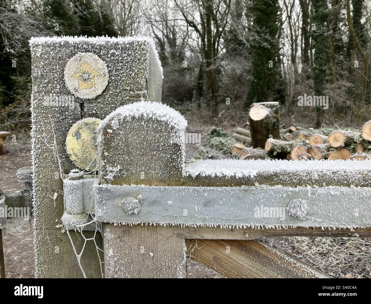 Footpath signs on a gate post covered in frost Stock Photo - Alamy