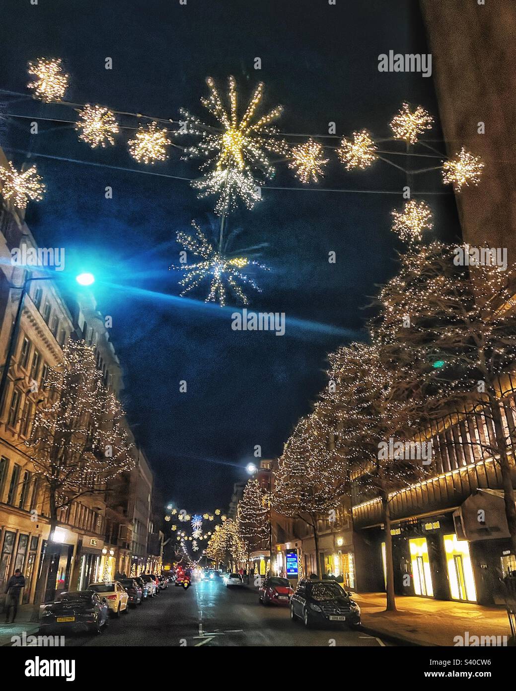 Christmas decorations in Knightsbridge London stars across the street ...