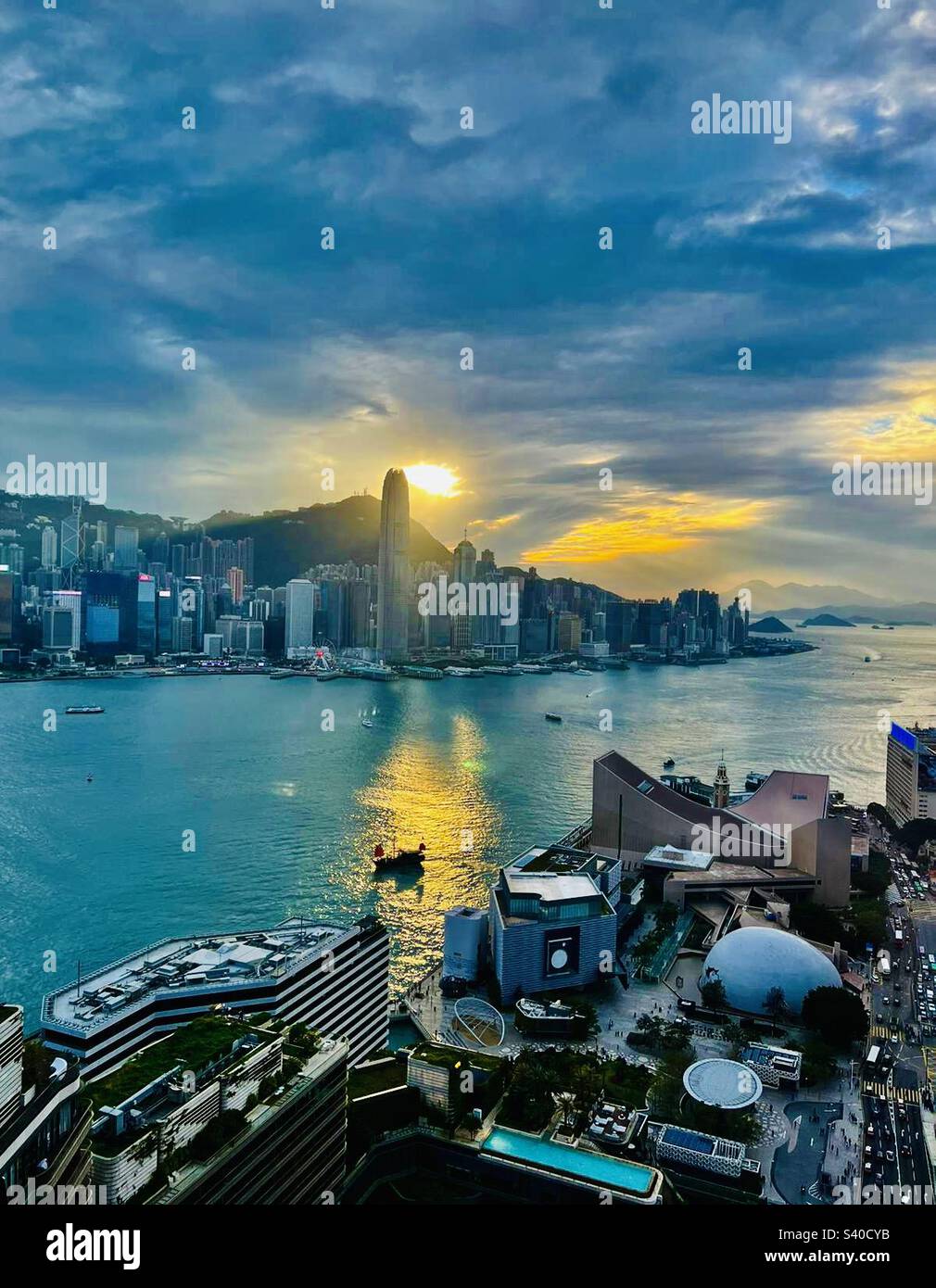Sunset over Victoria harbour in Hong Kong Stock Photo - Alamy