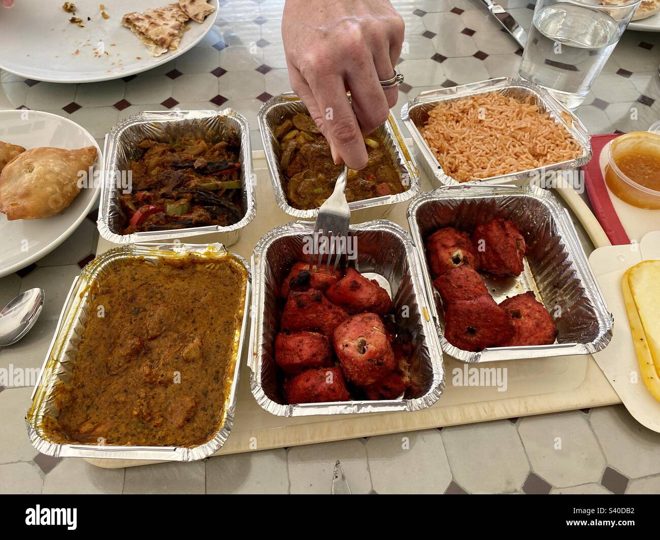 Take out Indian food in aluminium foil containers Stock Photo - Alamy
