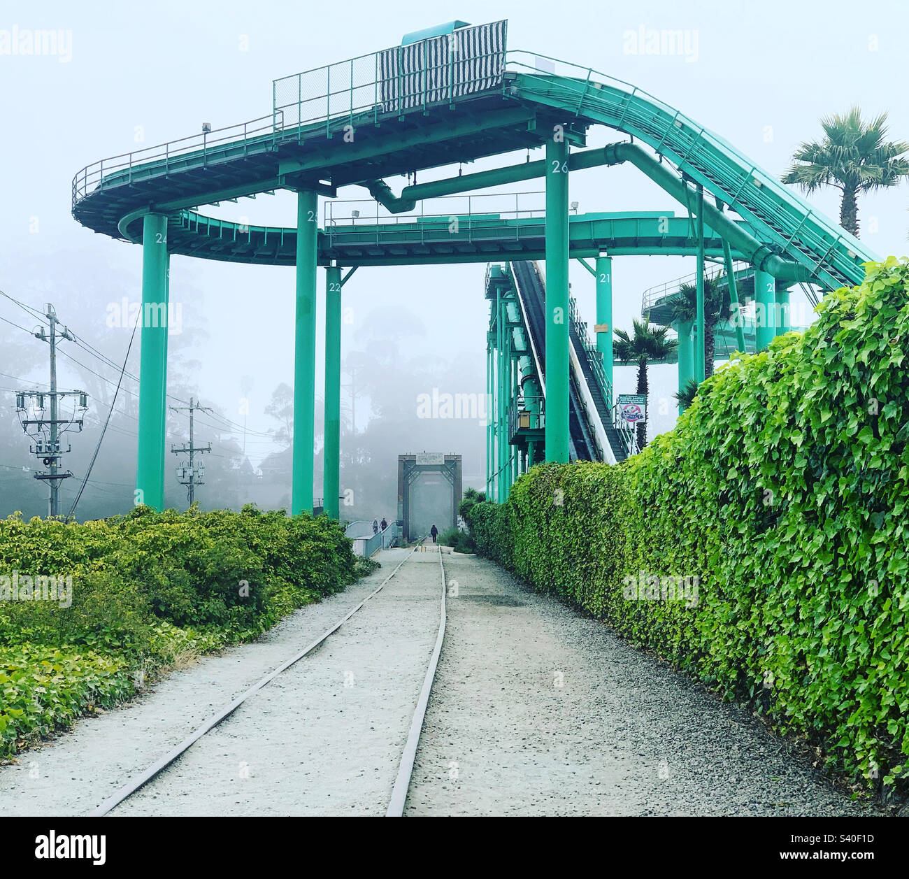 June, 2022, Under a roller coaster on a foggy morning prior to opening ...