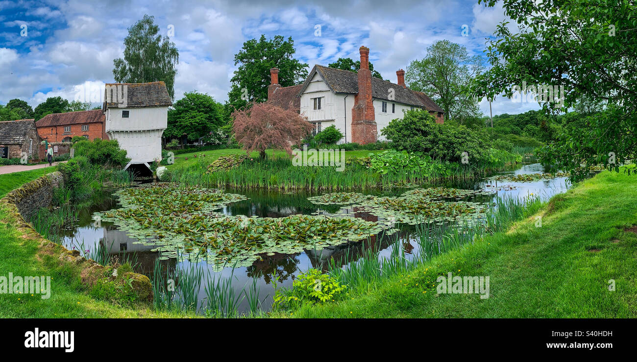 The picturesque moated manor house at historic Brockhampton Estate on a ...