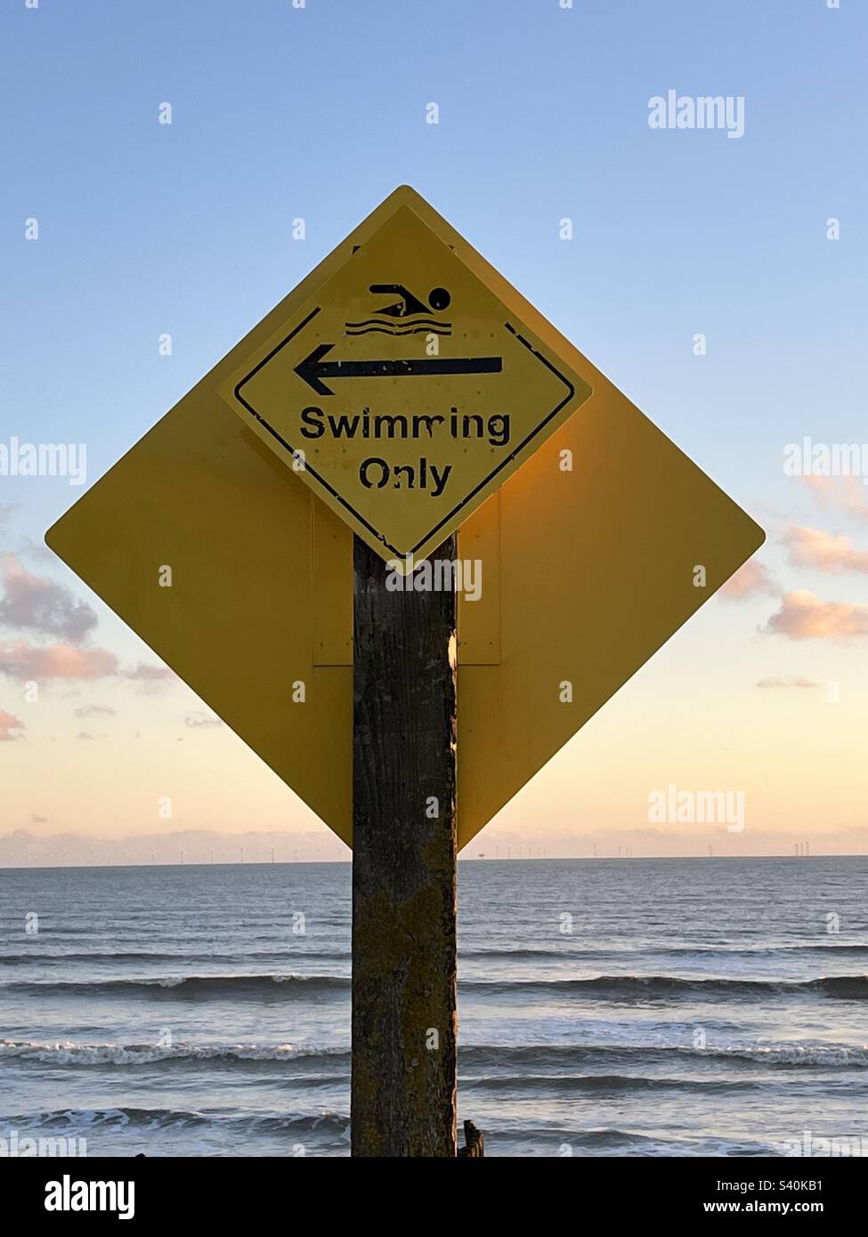 Yellow swimming only sign hi-res stock photography and images - Alamy