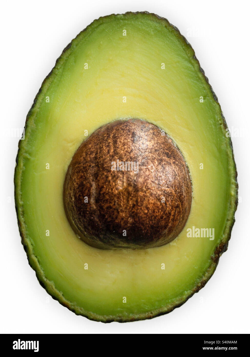 Fresh avocado cut in half to show the stone inside. Healthy meat free ...