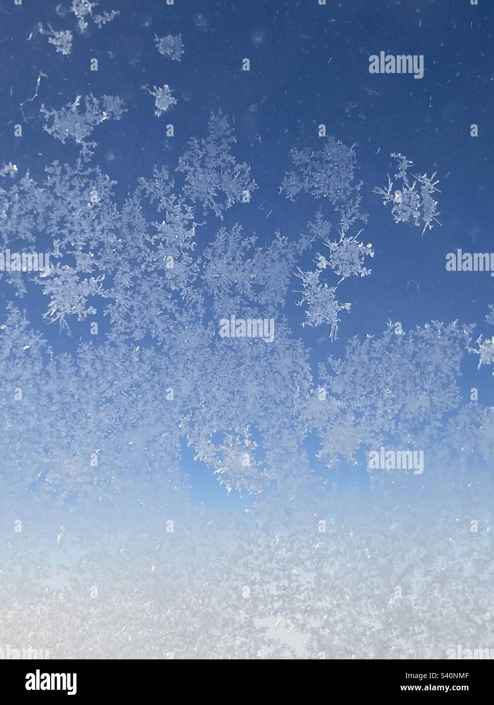 Ice crystals forming on an airplane window Stock Photo - Alamy