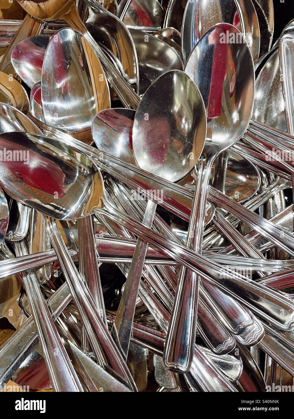 Close up of a bin of spoons in a retail store, 2023, United States ...
