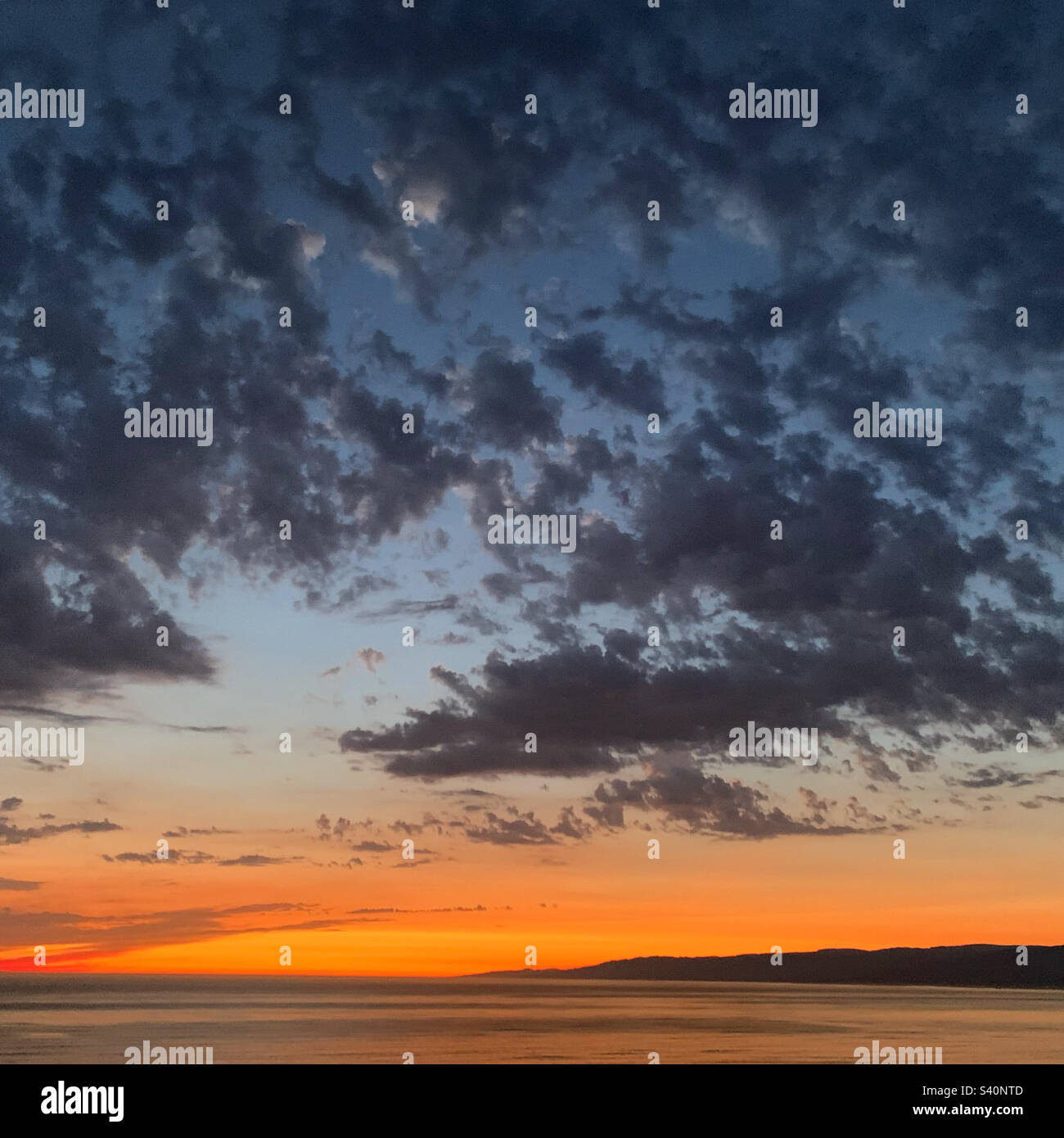 August, 2022, Sunset view from a cruise ship sailing past British ...