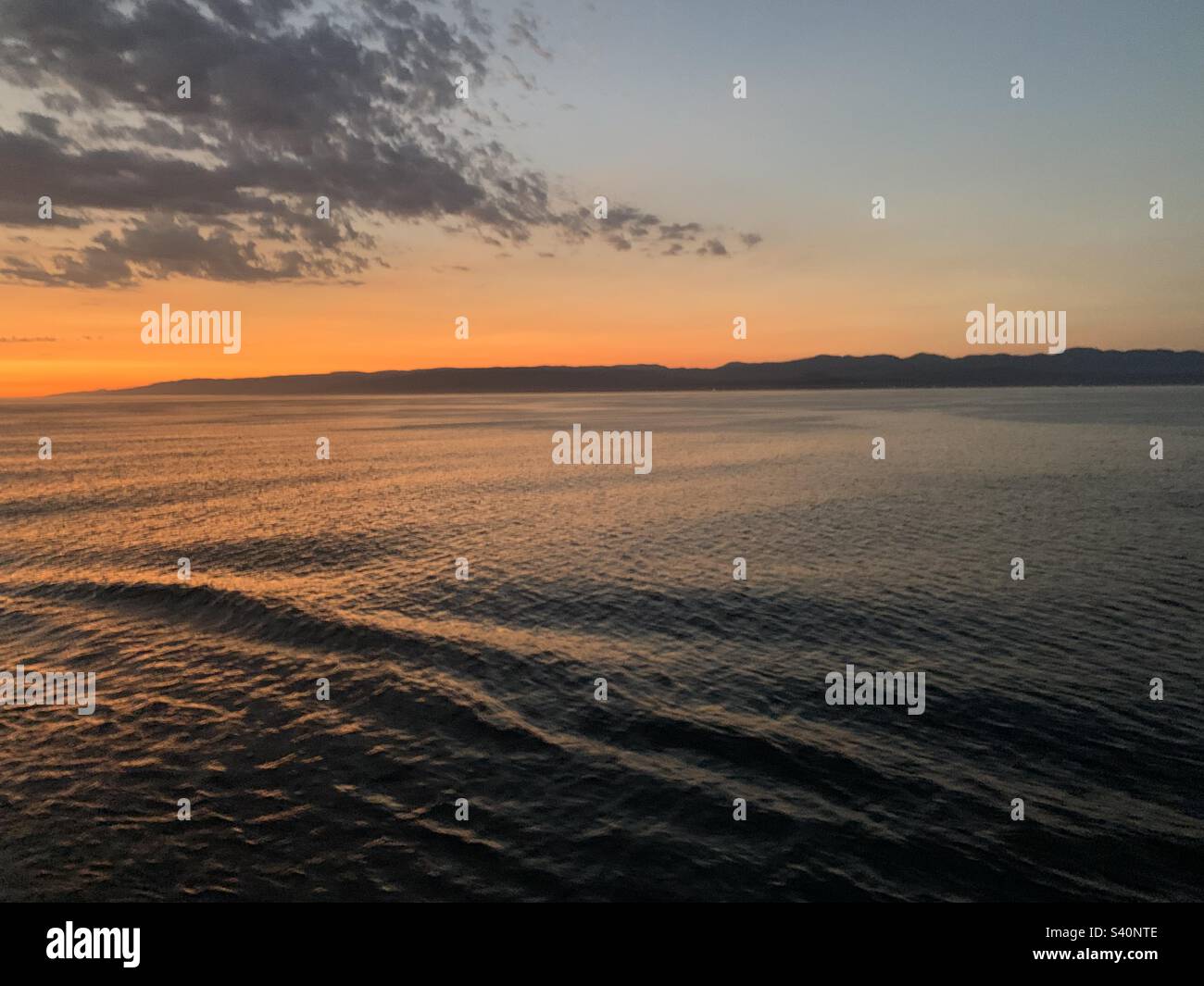 Sailing ship cruising sunset smartphone stock photos and images - Alamy