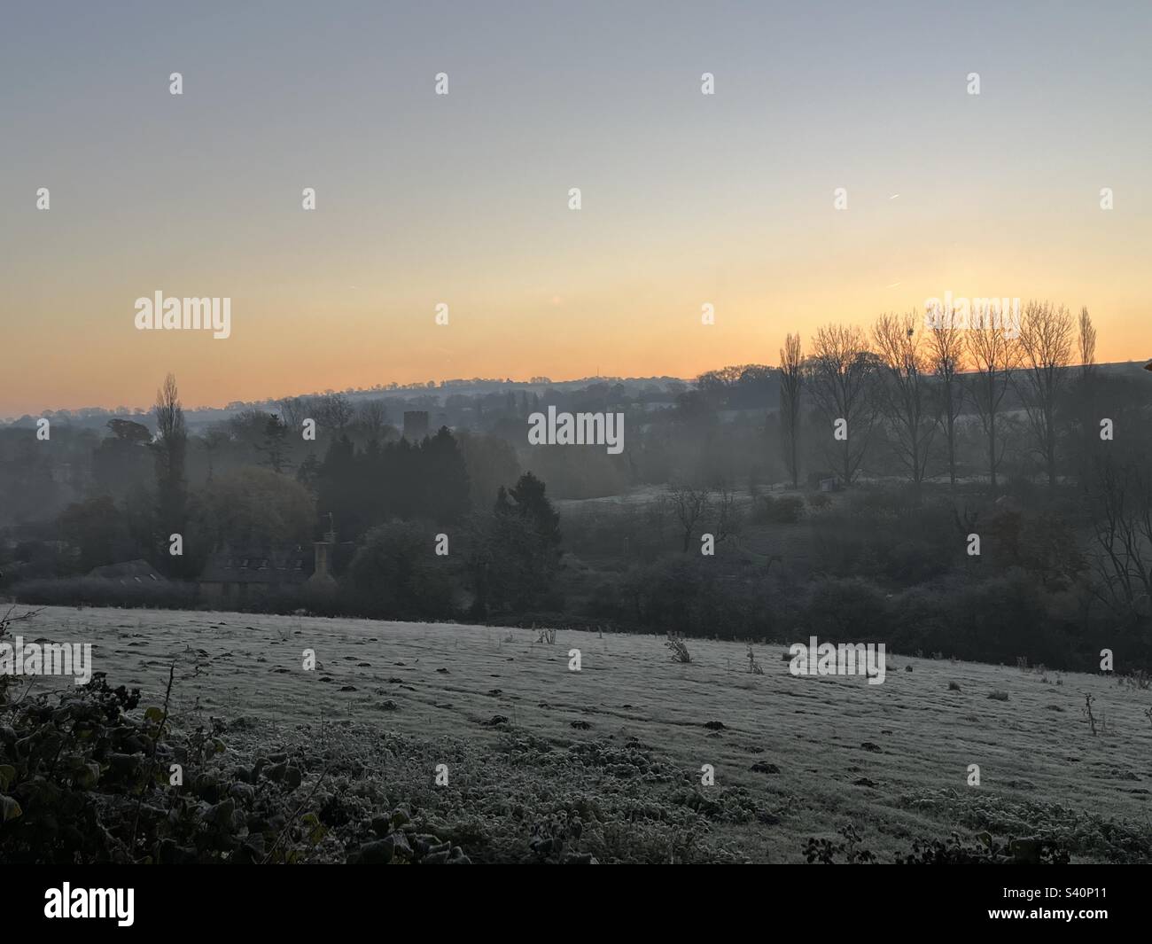 Sunrise across frosty fields Stock Photo - Alamy