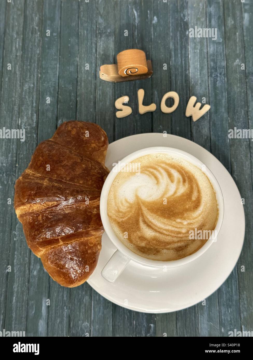 Slow breakfast at the bar with a cappuccino and croissant Stock Photo ...