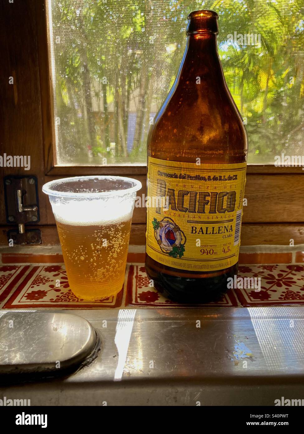 Large bottle of Pacifico beer with a bubbling plastic glass Stock Photo ...