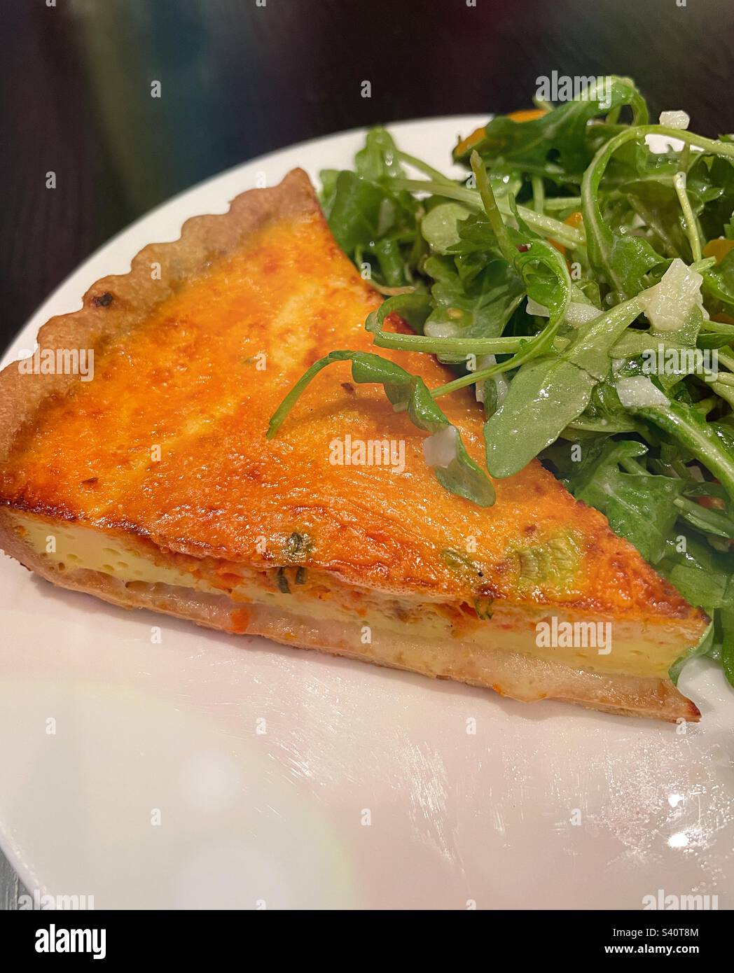 A slice of quiche and a salad for lunch entrée in a Midtown Manhattan ...