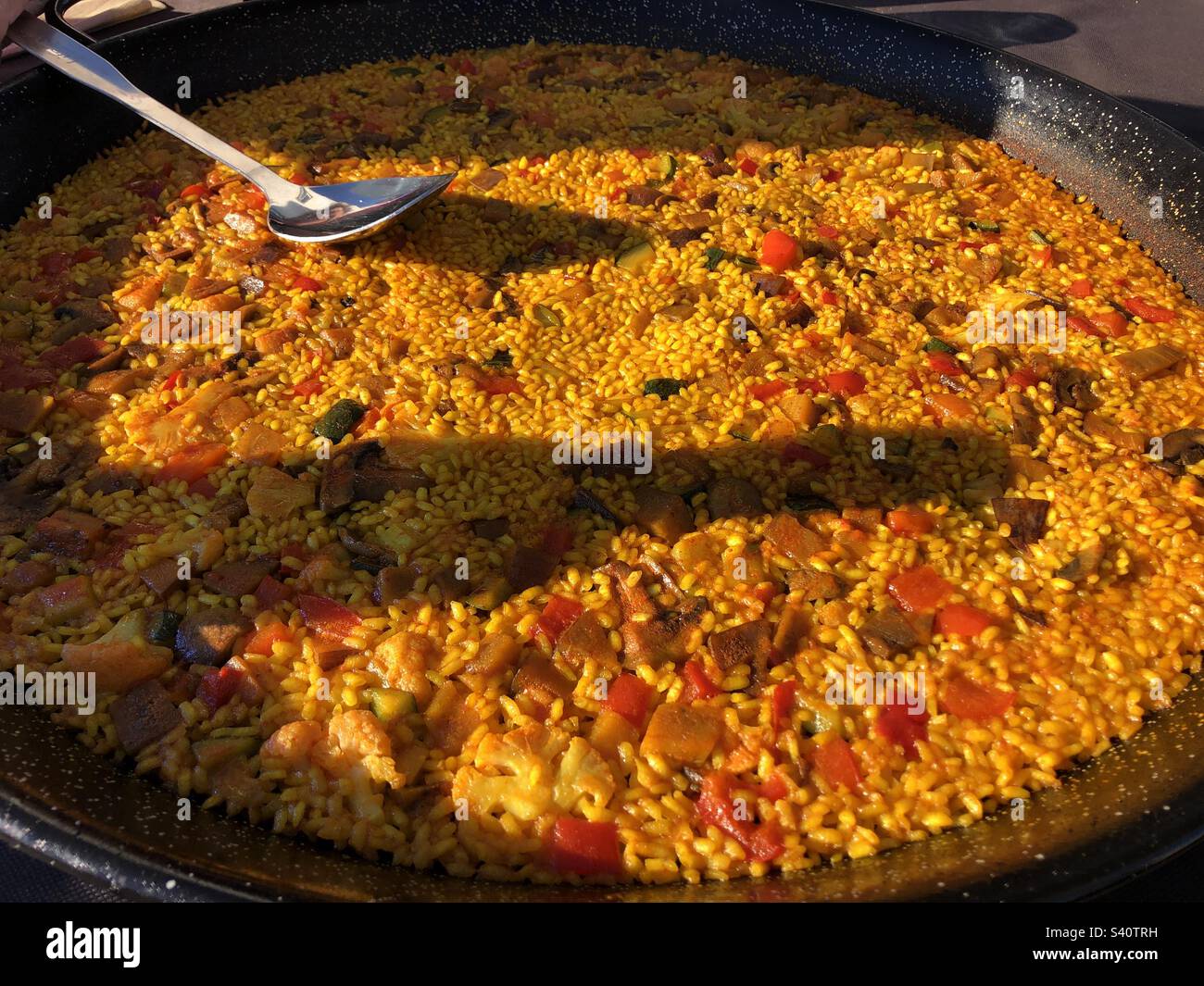 Valencian style vegetable rice paella on a tray Stock Photo - Alamy