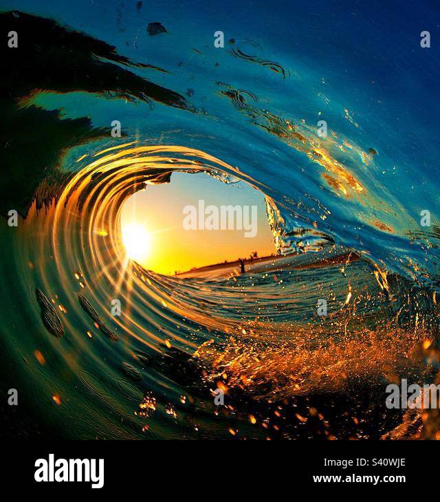 Sunset through the barrel of a wave Stock Photo - Alamy