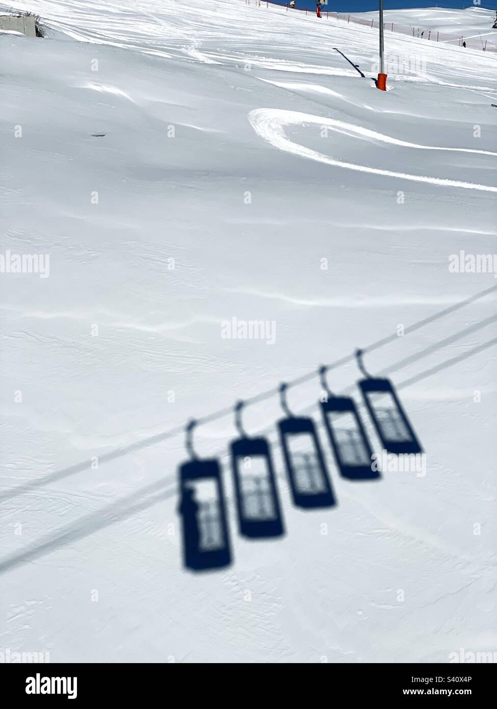 Ski lift shadow on fresh snow, Alpe d’Huez, France Stock Photo - Alamy
